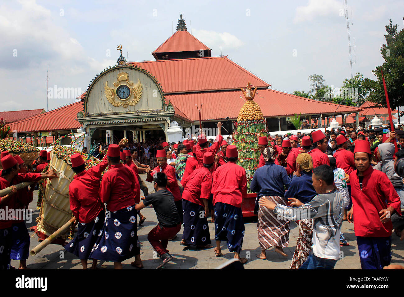 Residents scramble the contents of gunungan while Grebeg Maulud of ...