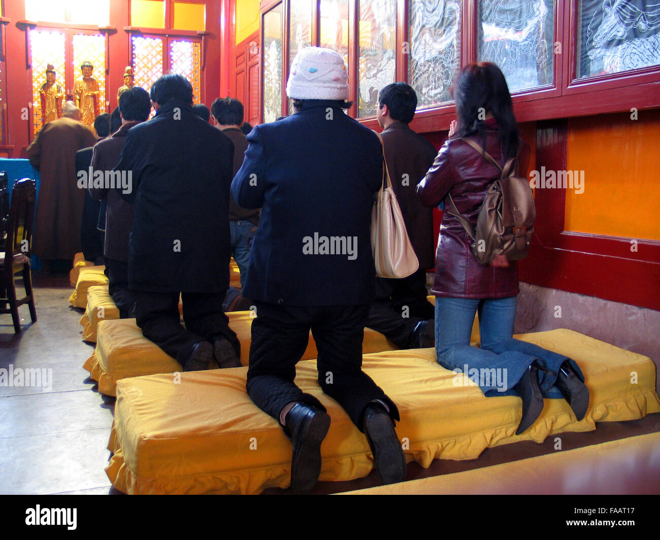 Buddhists praying in a temple in Sichuan Province, China Stock Photo ...