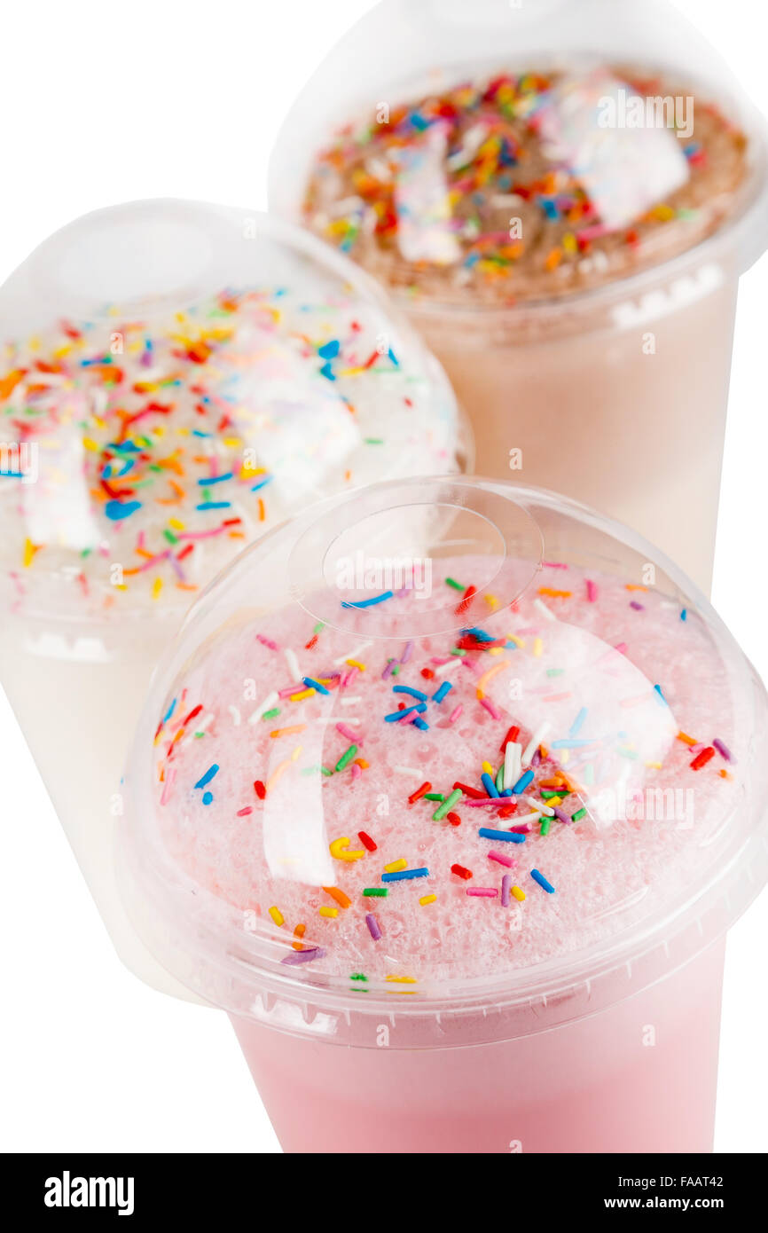 different milkshake cocktails with bubbles and multicolor bakery sweet ...