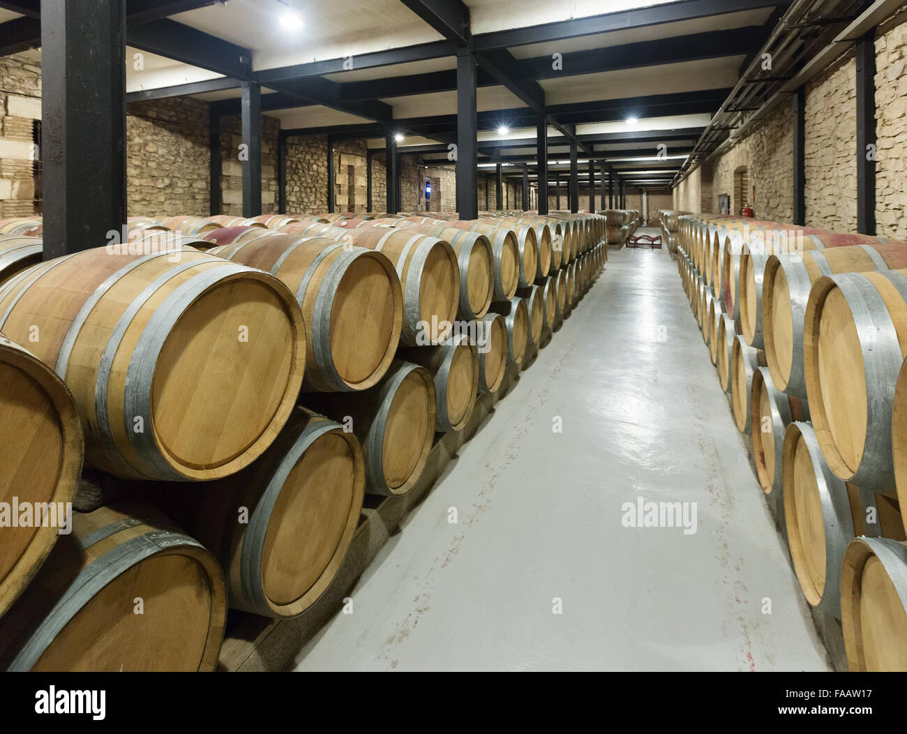 Interior of winery with wooden barrels in rows Stock Photo - Alamy