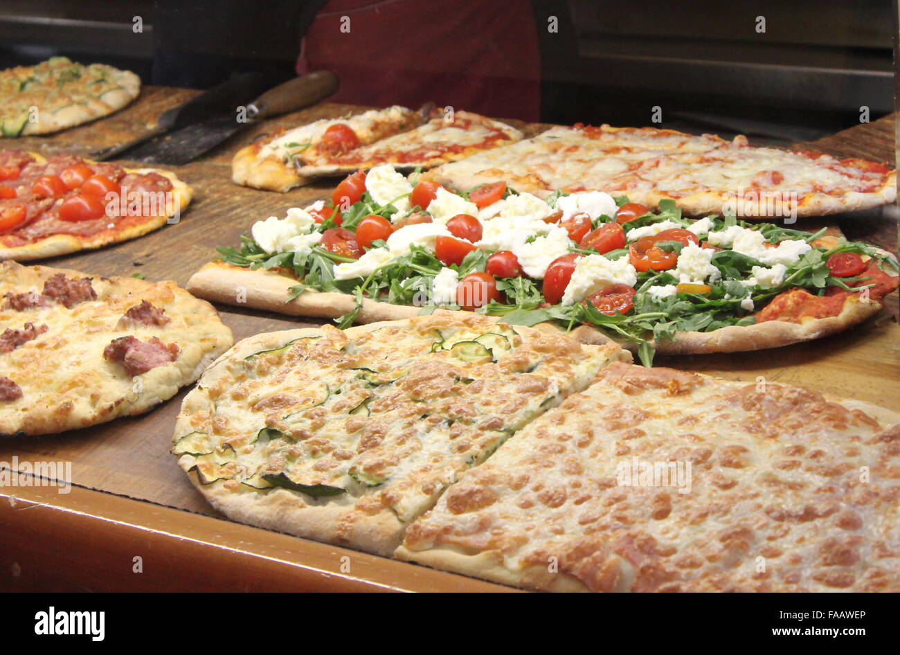 Different varieties of pizza displayed in a Pizzeria Stock Photo - Alamy