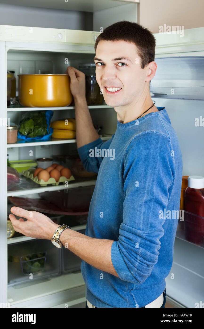 guy searching for something in refrigerator at home Stock Photo - Alamy