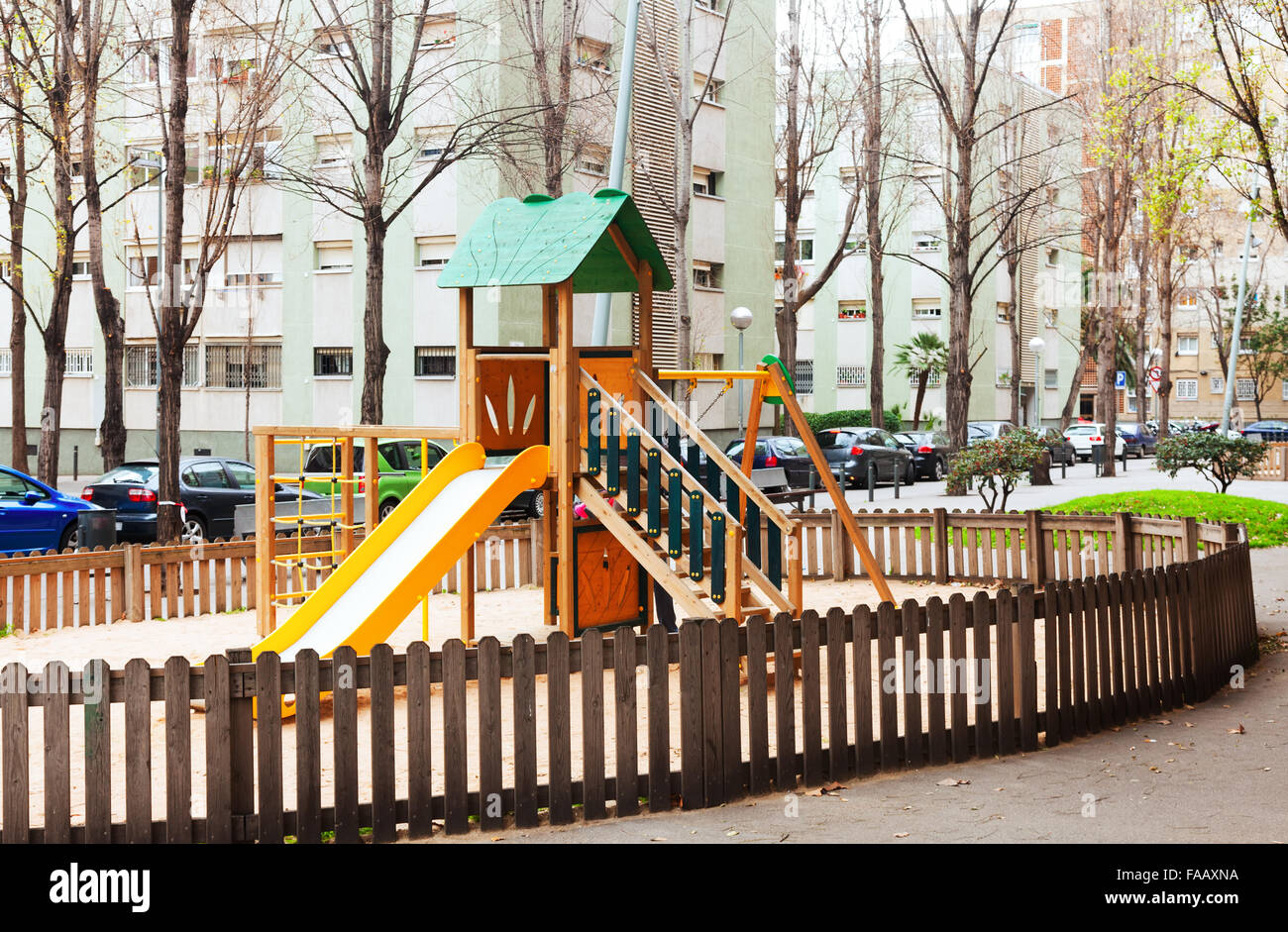 Wooden playground area in city yard Stock Photo - Alamy