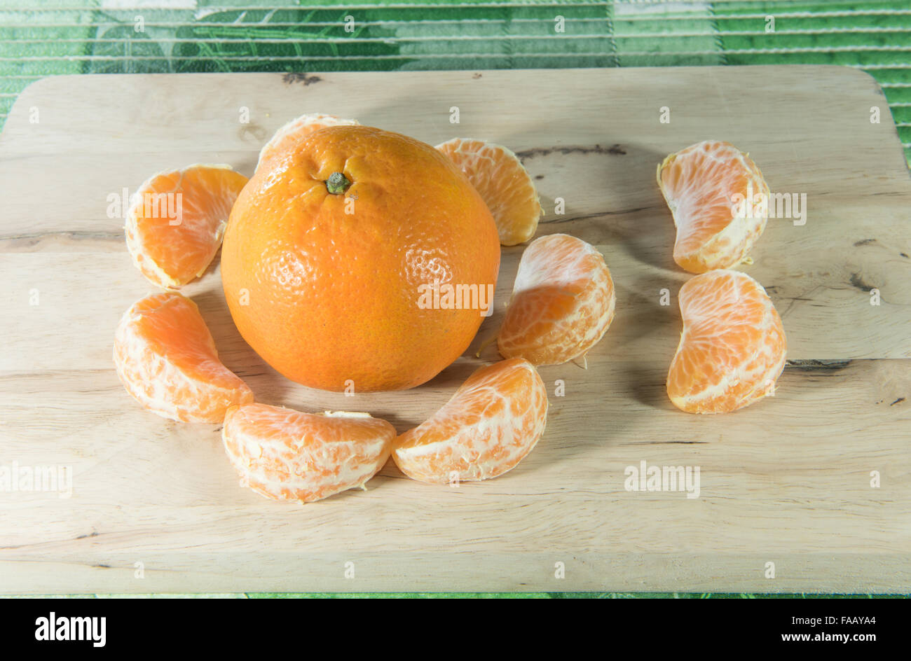 Orange on wooden block Stock Photo - Alamy