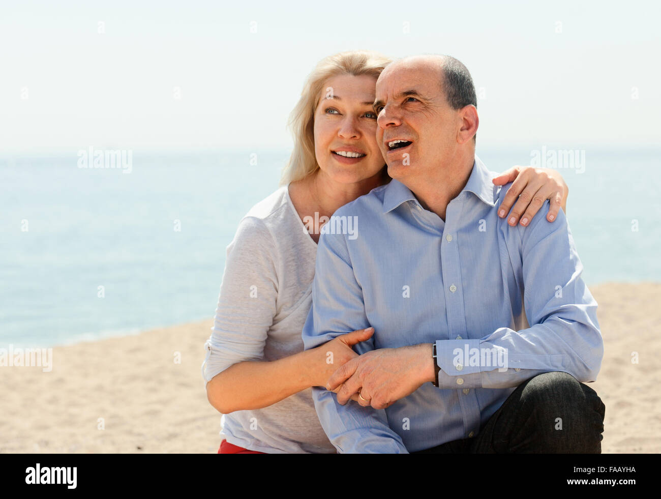 Happy elderly couple hugging outdoor on seaside Stock Photo - Alamy