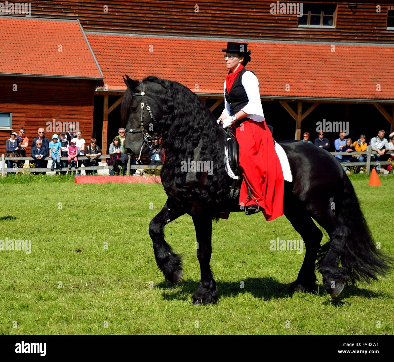 Woman riding black horse Stock Photo - Alamy