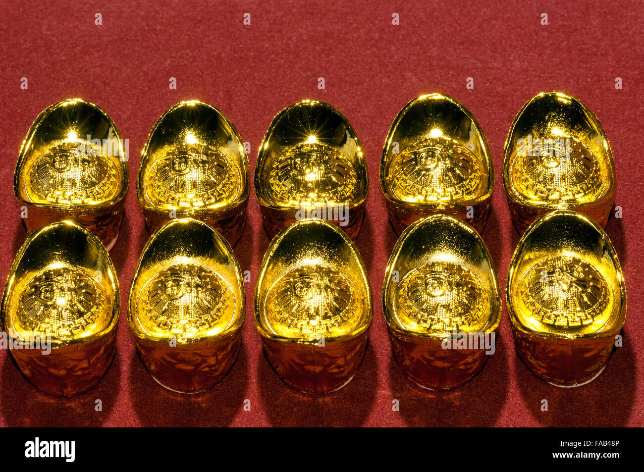 Small artificial Chinese auspicious gold ingots in studio setting Stock ...