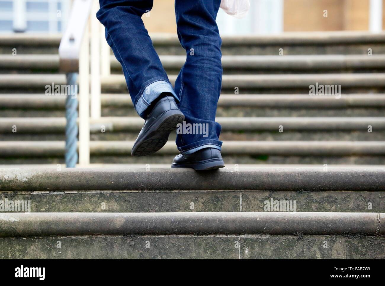 Person walking up steps, low section Stock Photo - Alamy