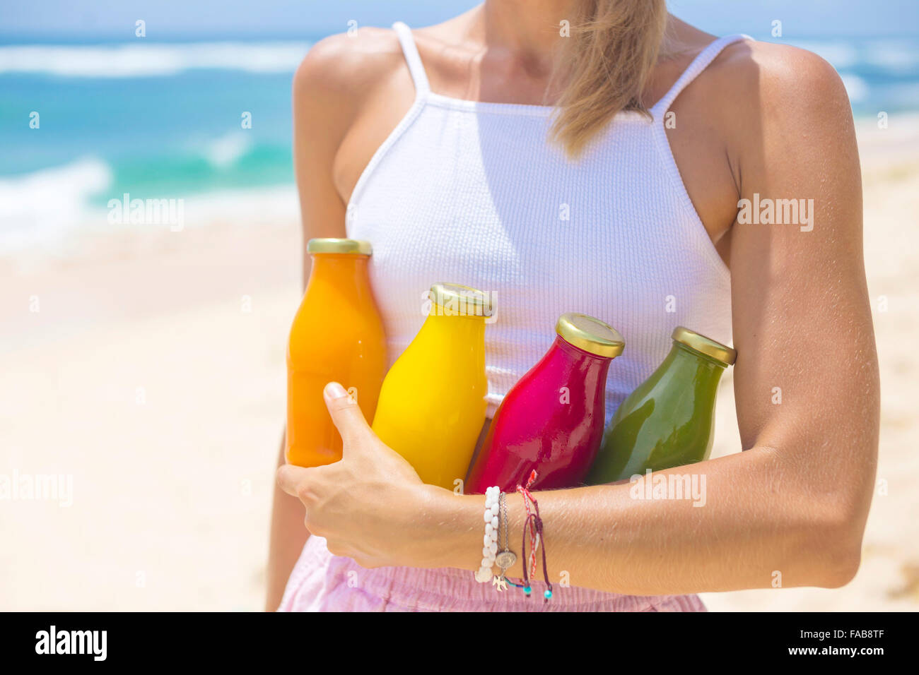 Young woman with fresh raw juices Stock Photo - Alamy