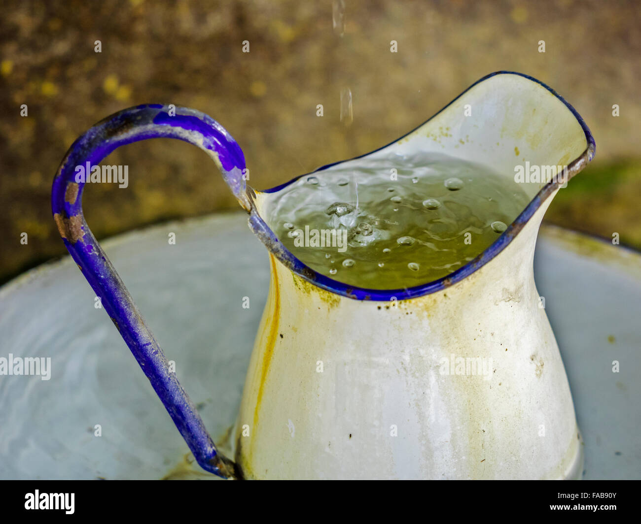 Rustic water pitcher and fountain town of Kaltern in Northern Italy ...