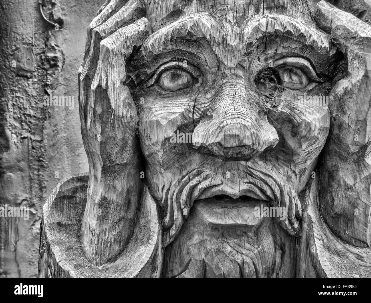 Wood carving of face in town of Kaltern (Caldaro) in South Tyrol area ...