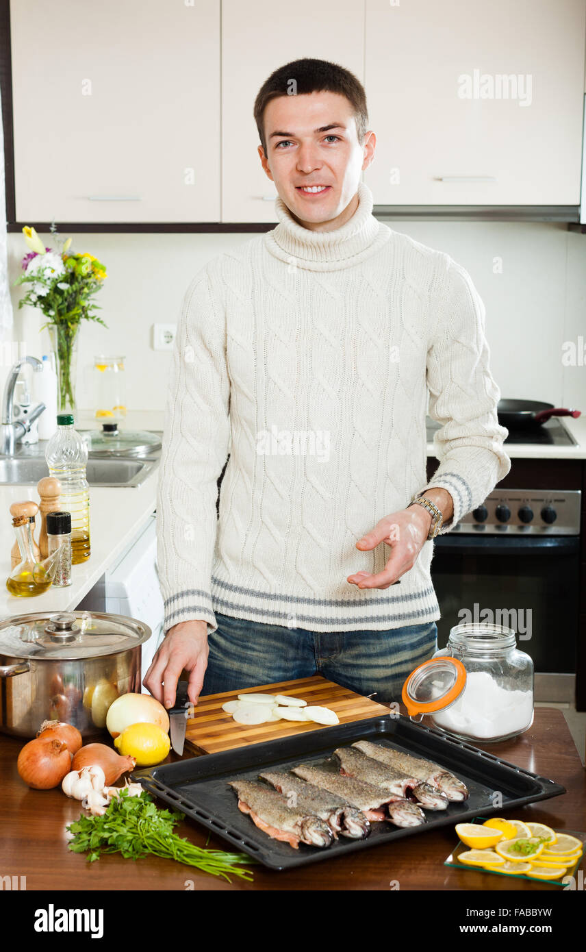 Guy cooking trout fish hi-res stock photography and images - Alamy