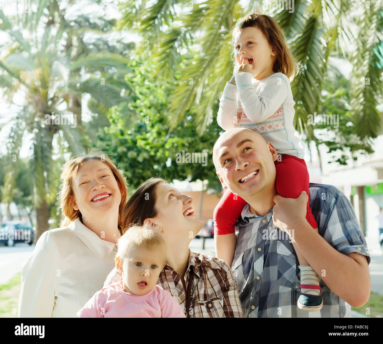Portrait of happy three generations family in summer Stock Photo - Alamy