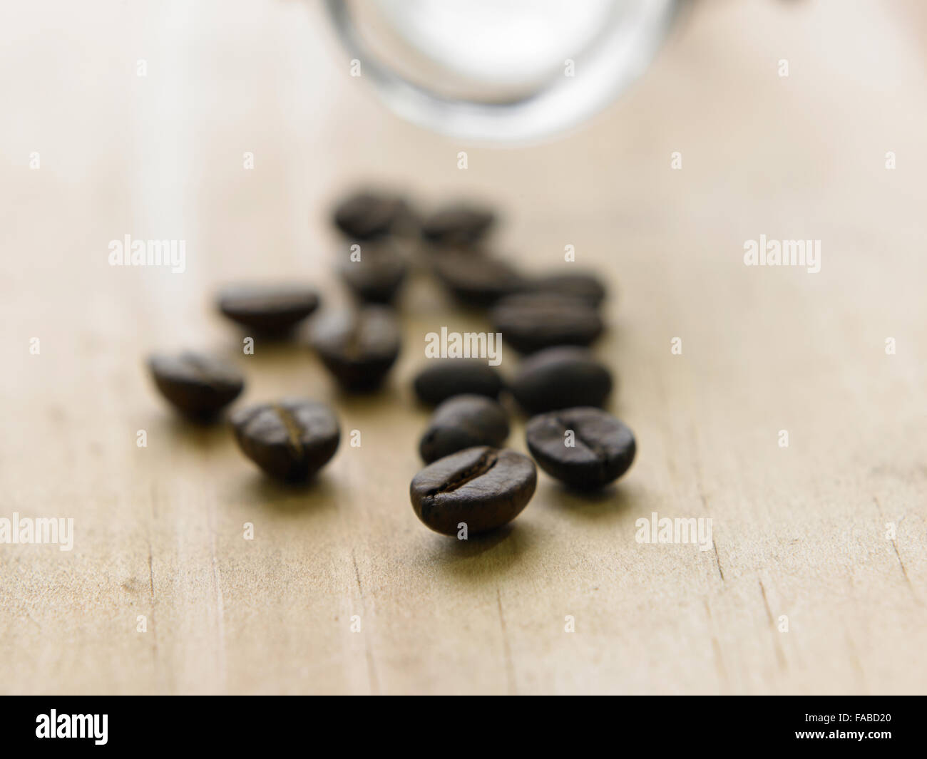 coffee beans out from the bottle Stock Photo - Alamy
