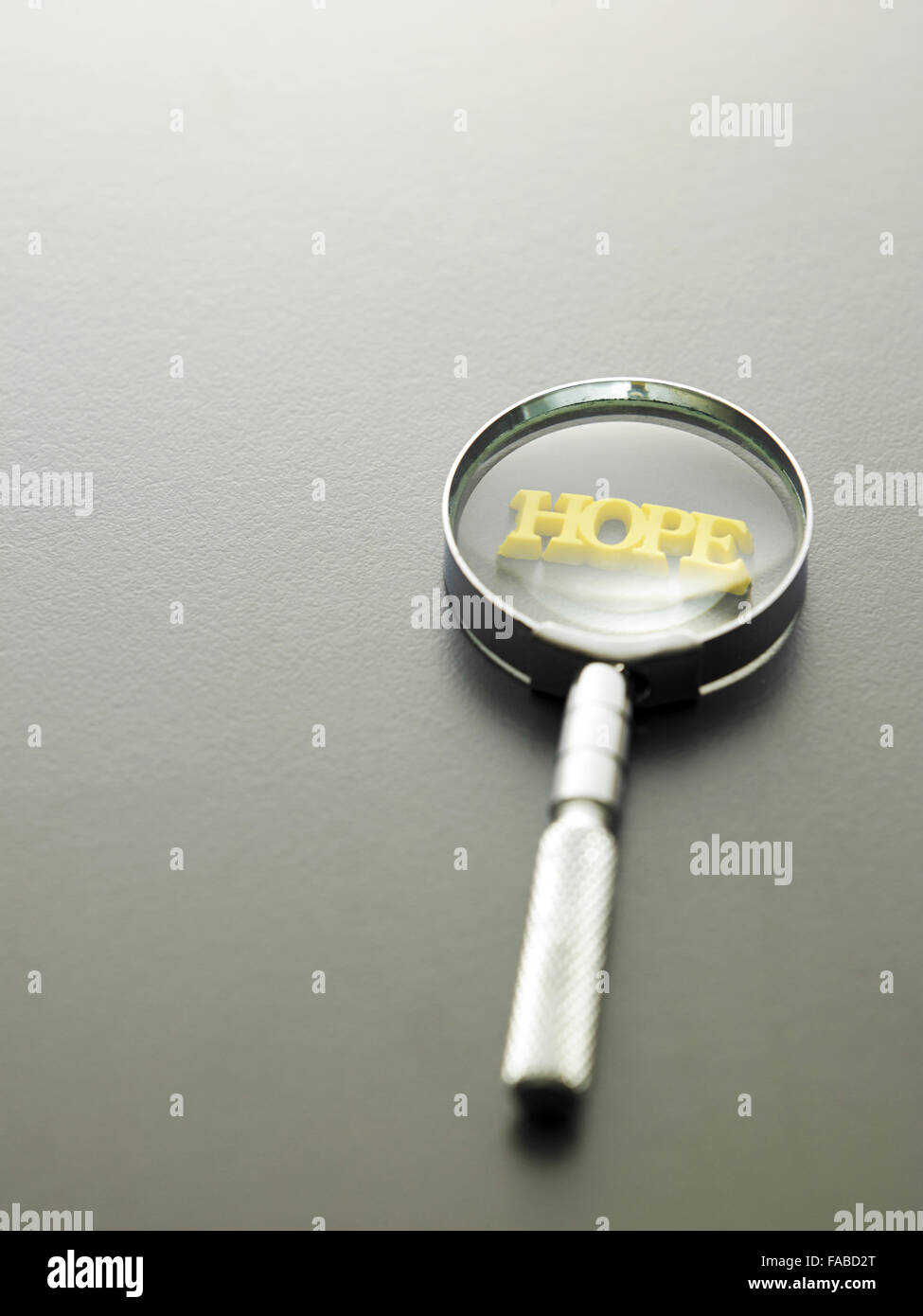 magnifying glass focus on alphabet hope Stock Photo - Alamy