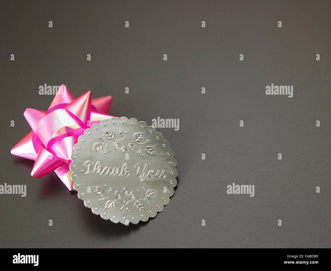 thank you sticker and ribbon Stock Photo - Alamy