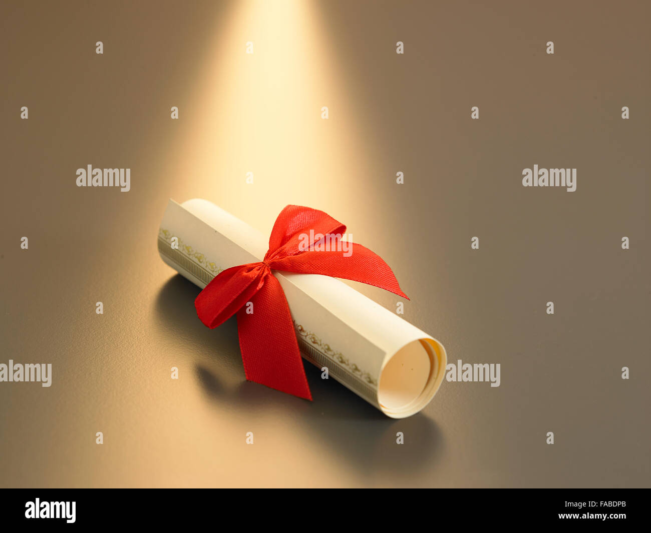 roll up certificate with red ribbon Stock Photo - Alamy
