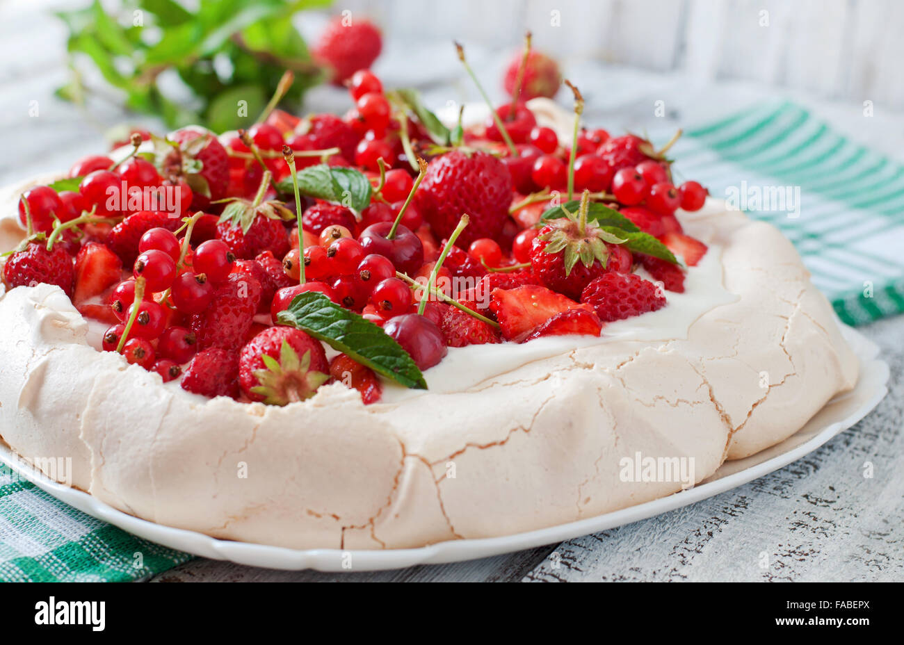 Meringue Cake "Pavlova" with cream and berries Stock Photo - Alamy