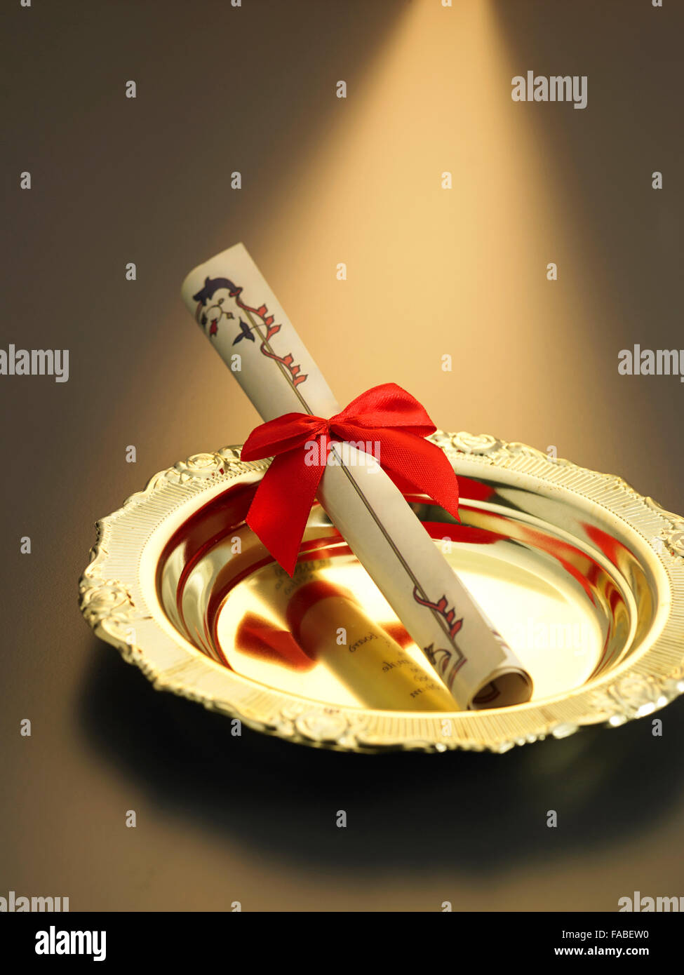certificate with ribbon on golden tray Stock Photo - Alamy