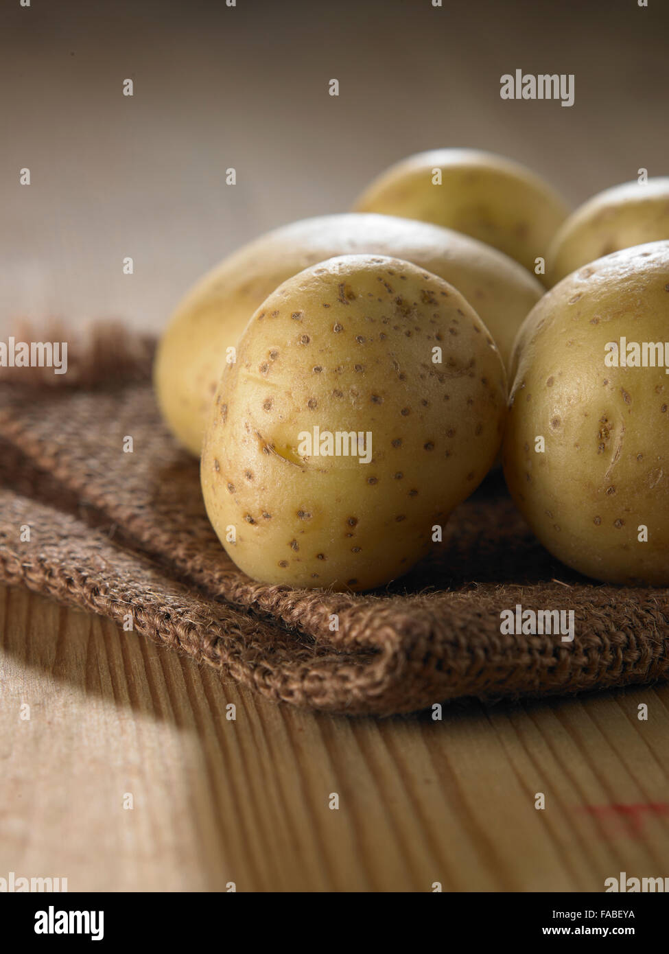 few potatoes on the kitchen top Stock Photo - Alamy