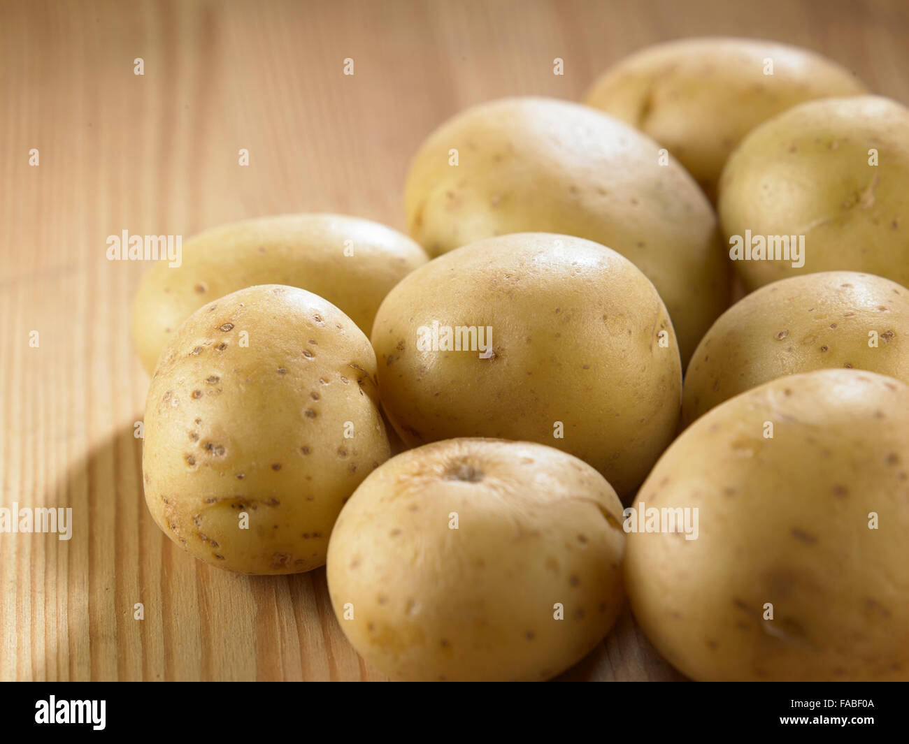 few potatoes on the kitchen top Stock Photo - Alamy