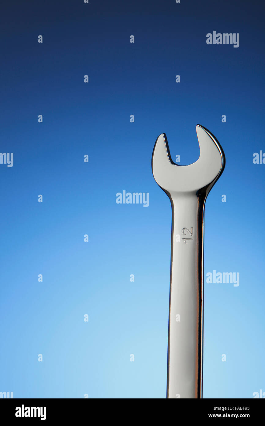 wrench on the blue background Stock Photo - Alamy