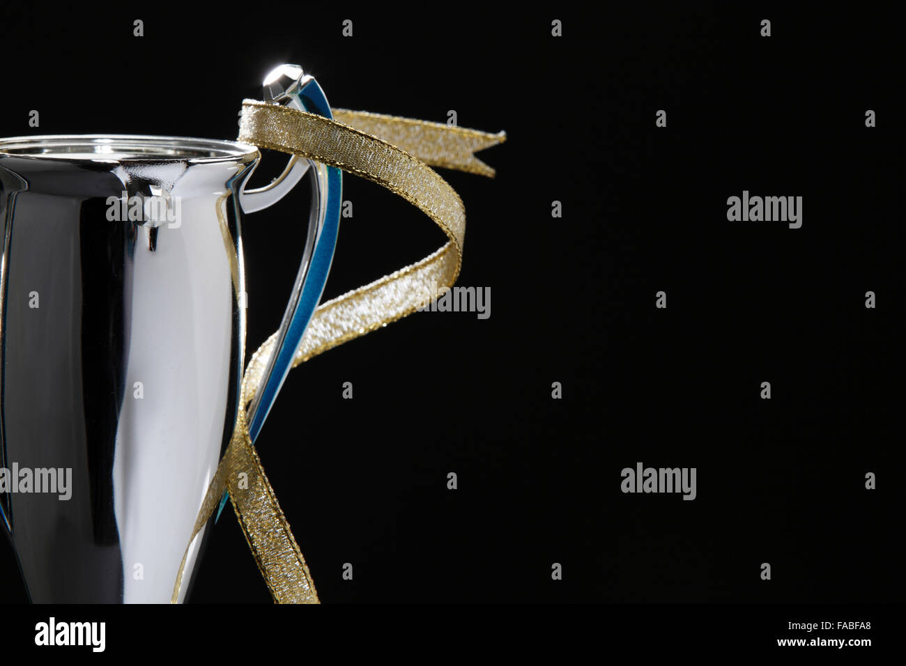 silver cup and the golden ribbon Stock Photo - Alamy