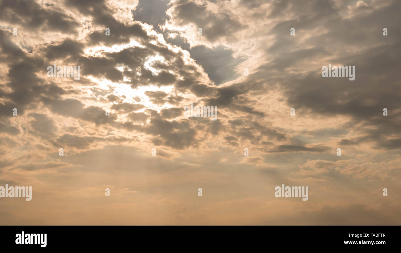 Light streaming through clouds evening Stock Photo - Alamy