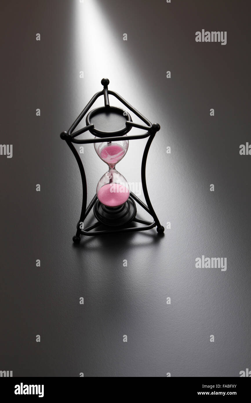 hour glass on the gray background Stock Photo - Alamy