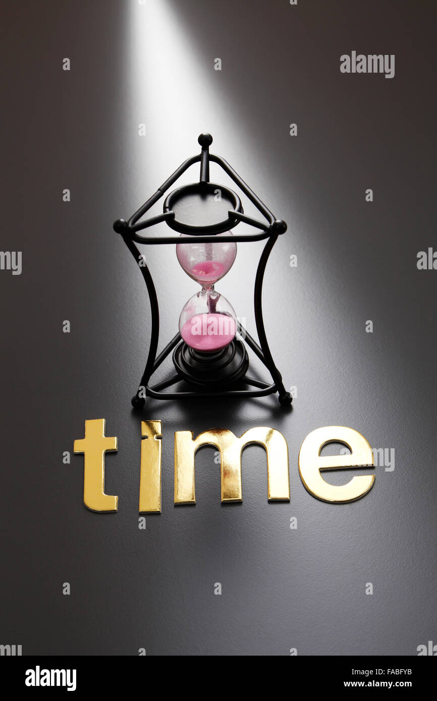hour glass on the gray background Stock Photo - Alamy