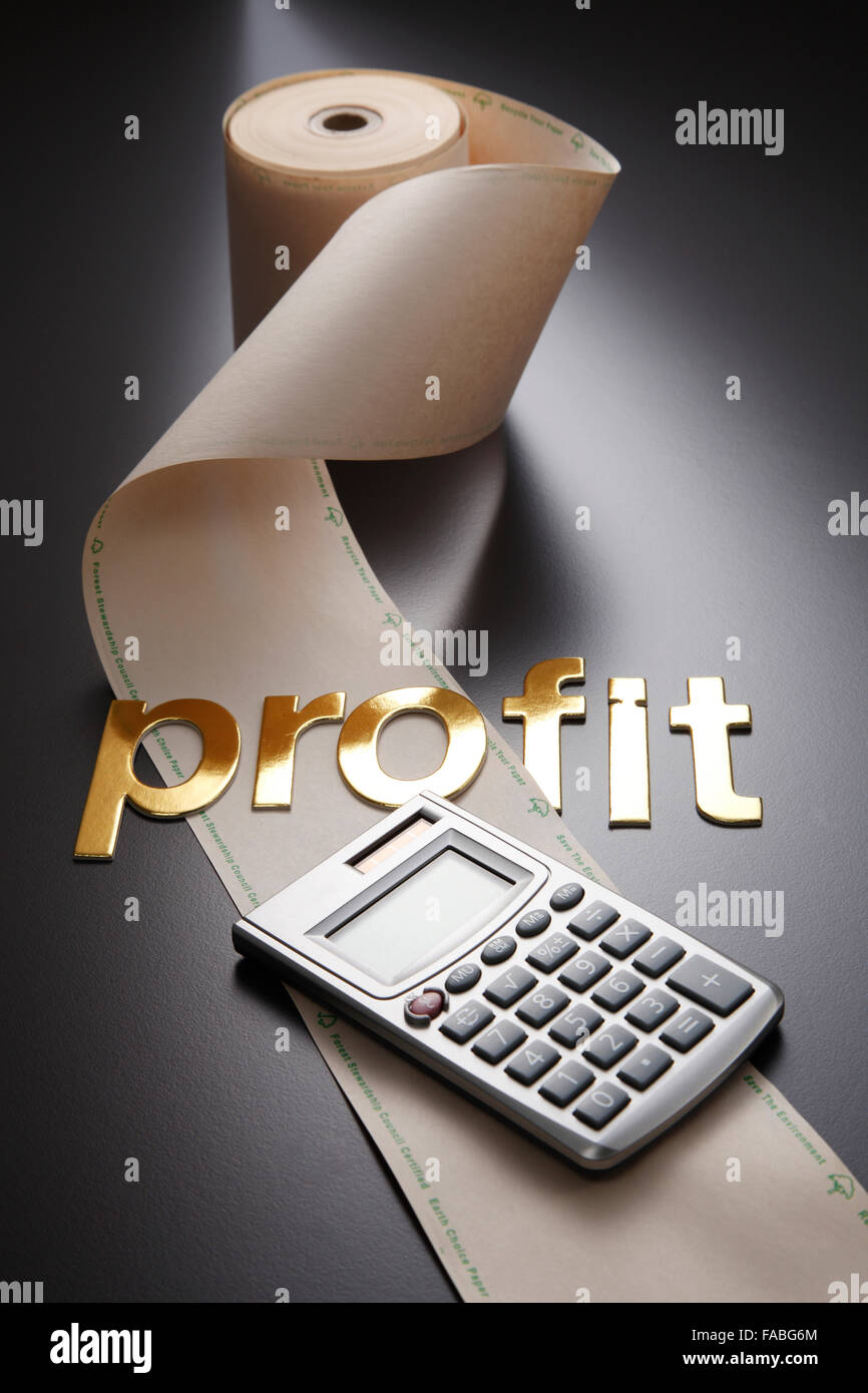 adding machine tape and calculator with word profit Stock Photo - Alamy