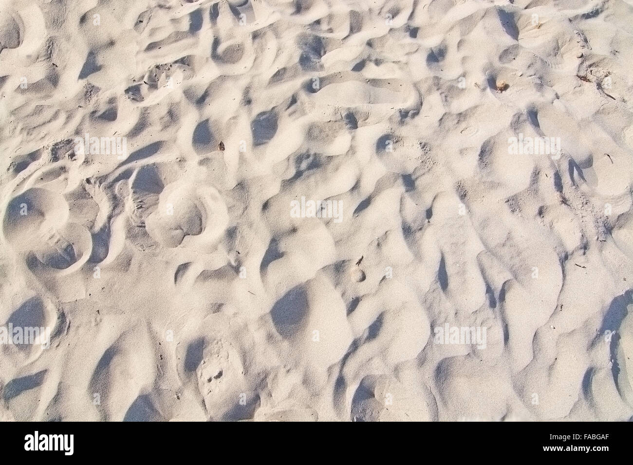Miniature sand dunes shaped in soft fine grained sand, full frame ...