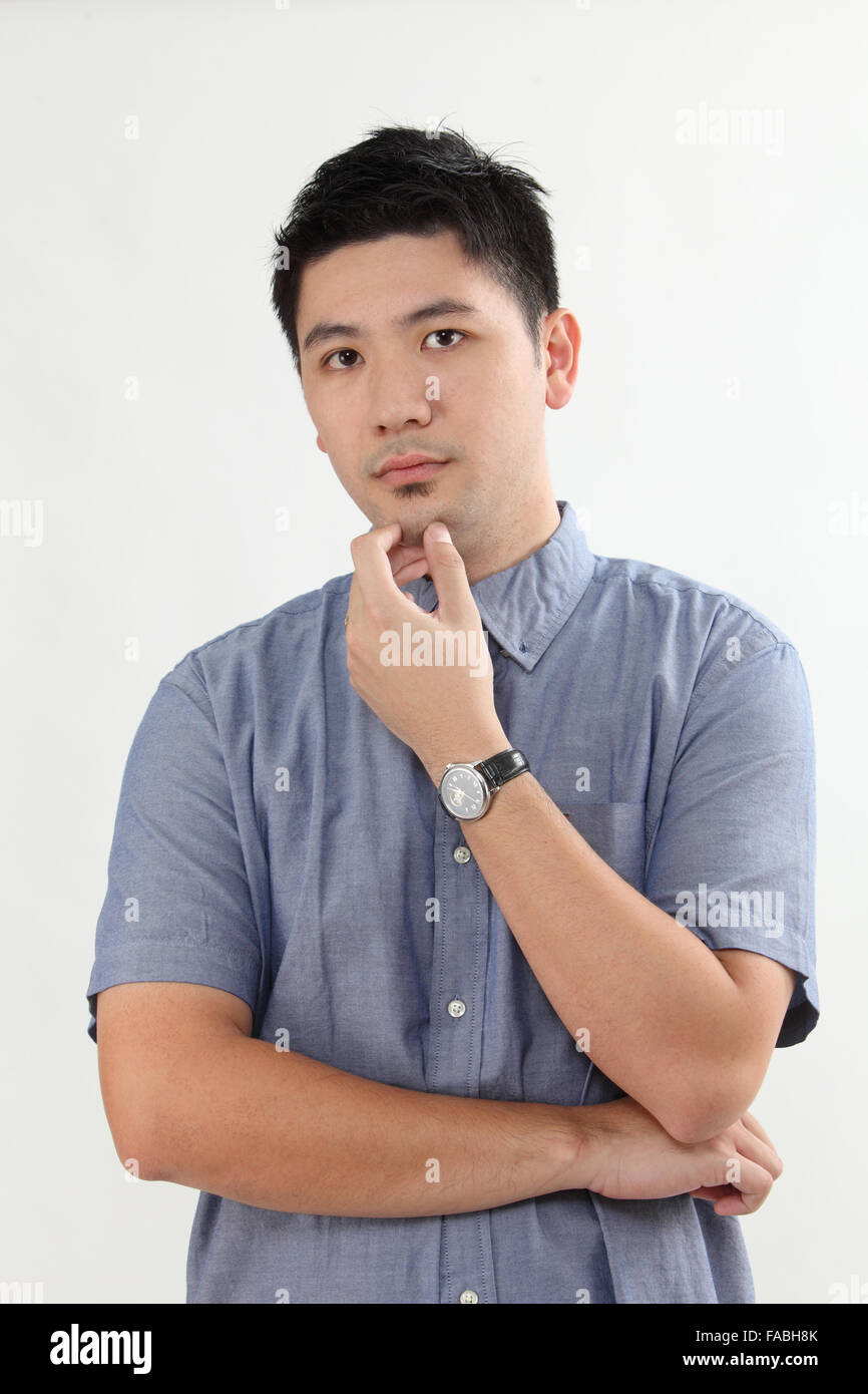 portrait of the chinese man hand on chin Stock Photo - Alamy