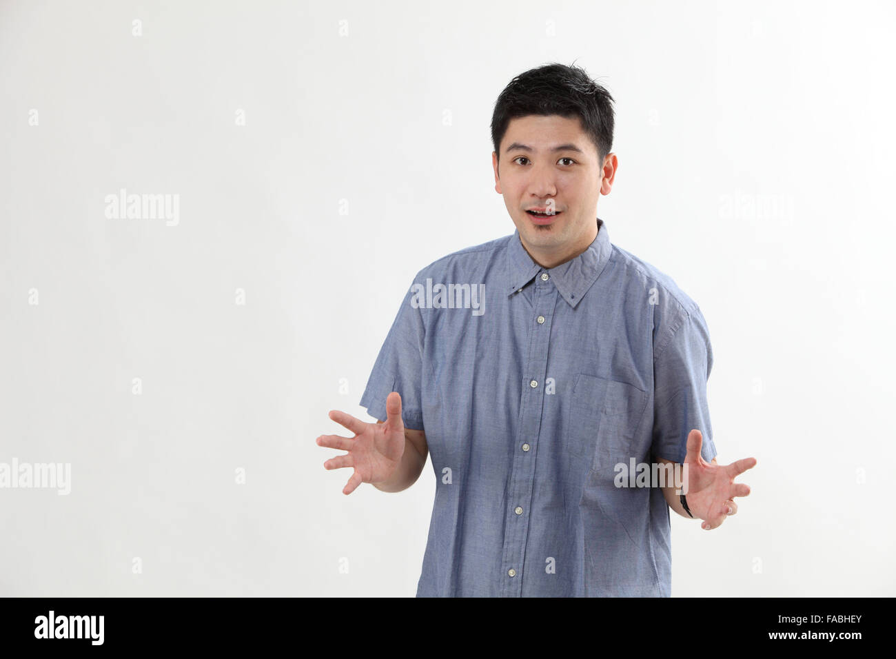 Surprised chinese man looking camera hi-res stock photography and ...