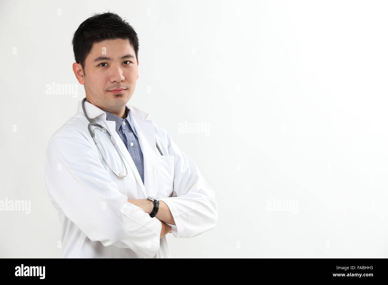 chinese doctor with the arm crossed Stock Photo - Alamy