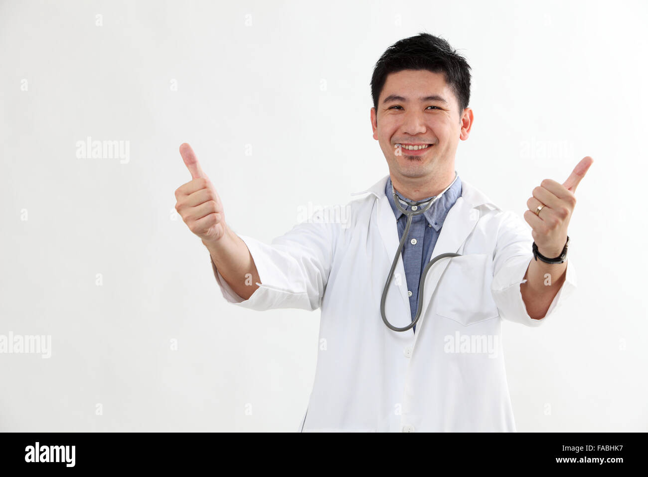 chinese doctor with thumb's up Stock Photo - Alamy