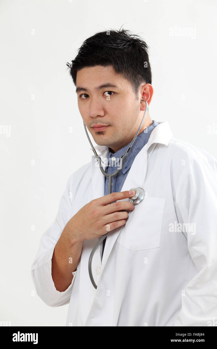 doctor using stethoscope listening to his own heart beat Stock Photo ...