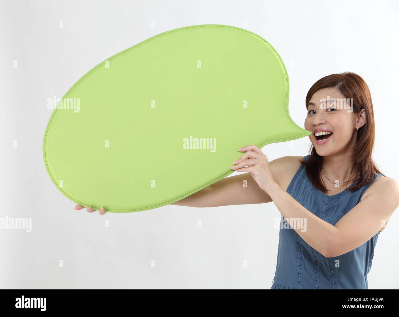 chinese woman holding a speech bubble Stock Photo - Alamy