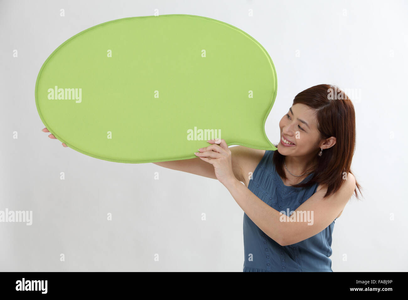 chinese woman holding a speech bubble Stock Photo - Alamy