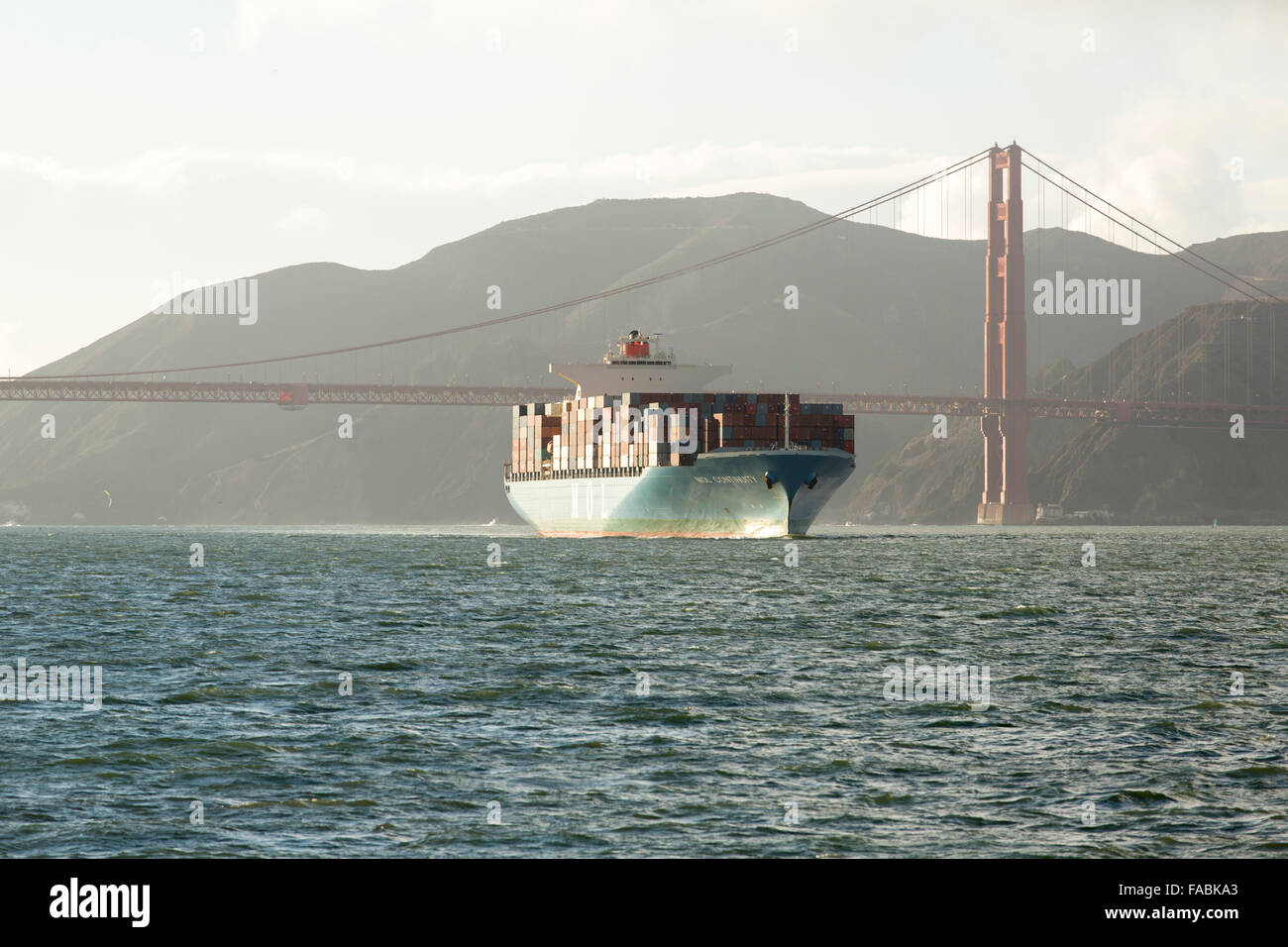 Container ship with the Golden Gate Bridge in the background, San ...