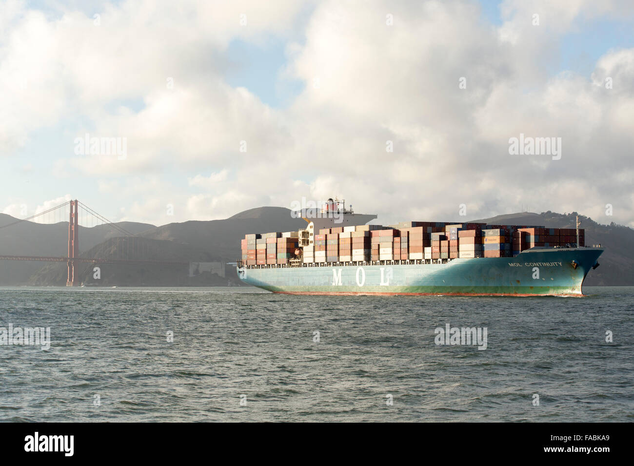 Container ship with the Golden Gate Bridge in the background, San ...