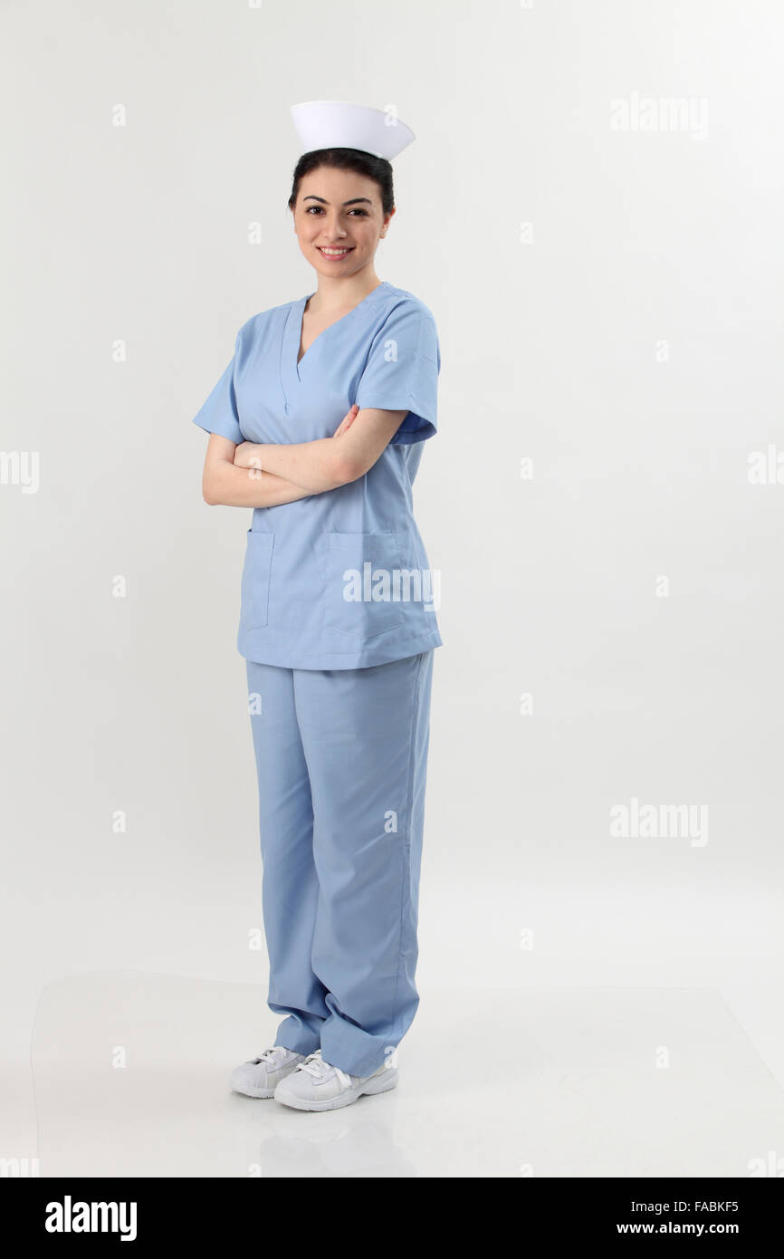 full length of nurse standing on the white background Stock Photo - Alamy