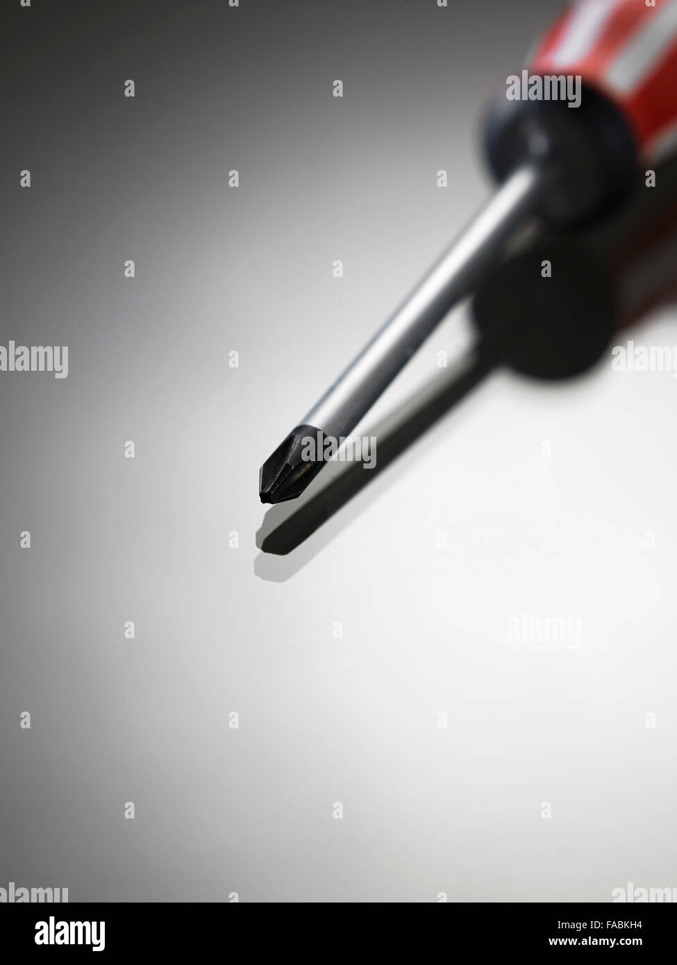 screwdriver on the gray background Stock Photo - Alamy