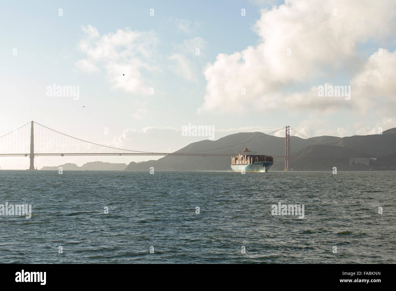 Container ship with the Golden Gate Bridge in the background, San ...