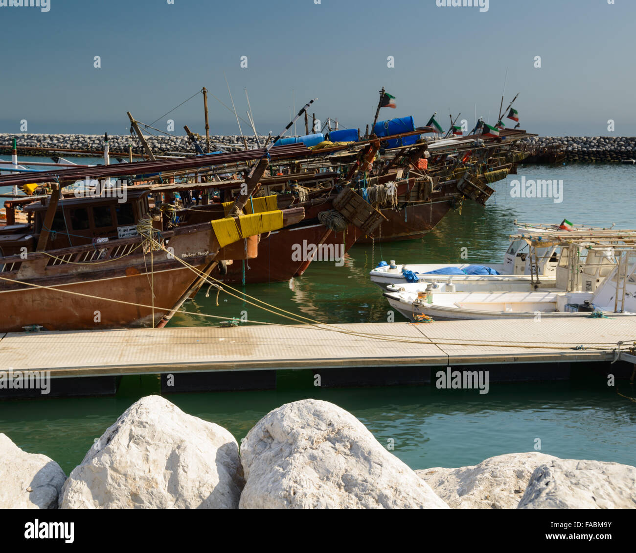 Traditional-style fishing boats in harbour next to Al-Kout Mall ...