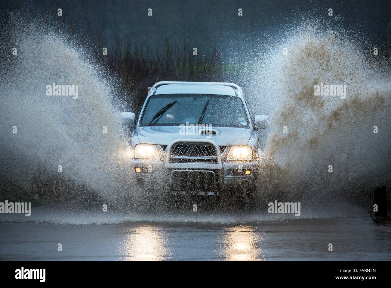 Car driving through floodwater hi-res stock photography and images - Alamy