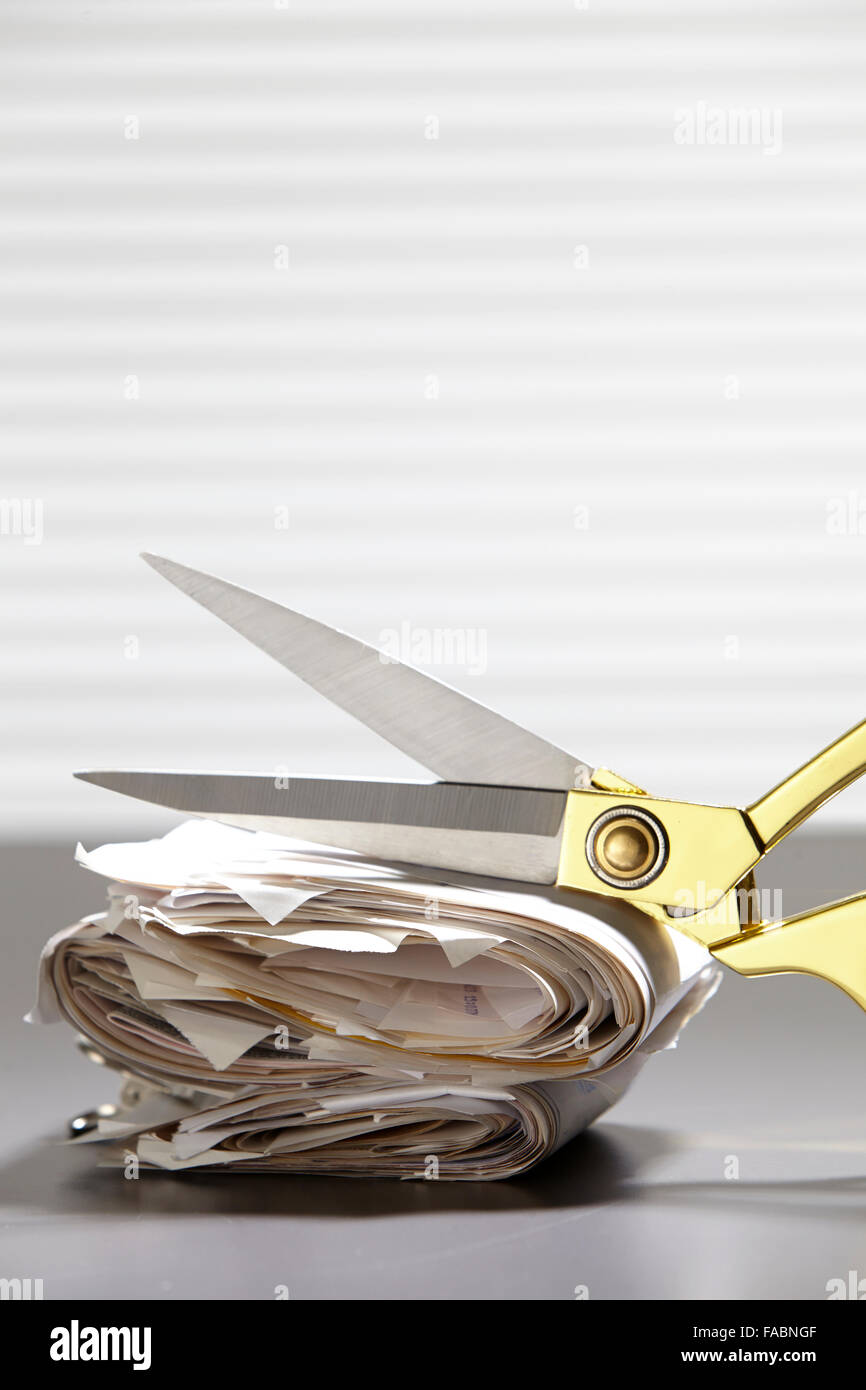 scissors resting on stack of the receipt Stock Photo - Alamy