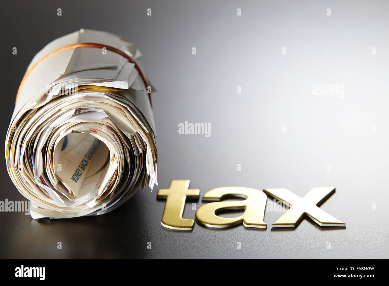 alphabet tax and rolled expense receipt Stock Photo - Alamy