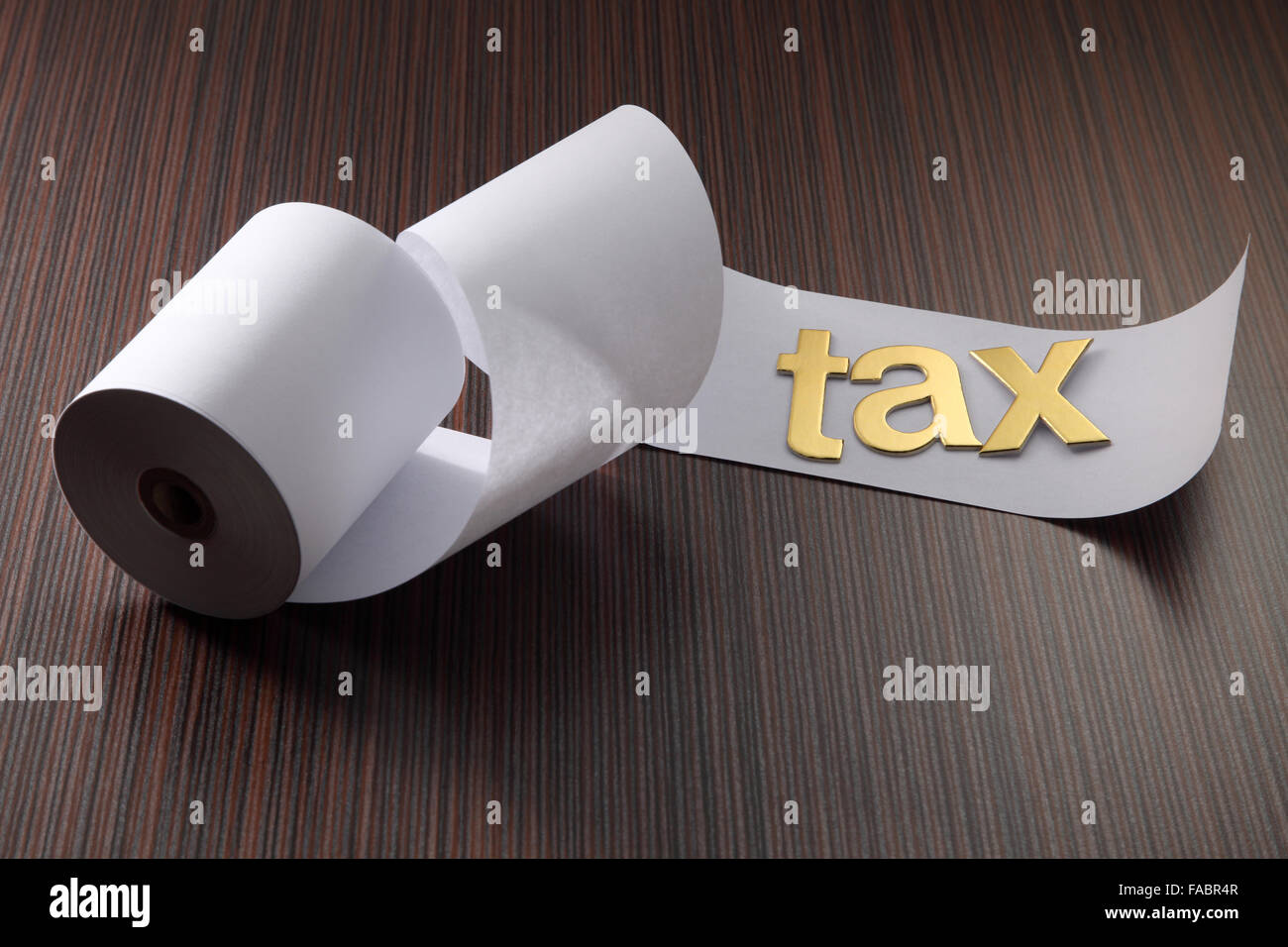 word tax on the roll of paper Stock Photo - Alamy