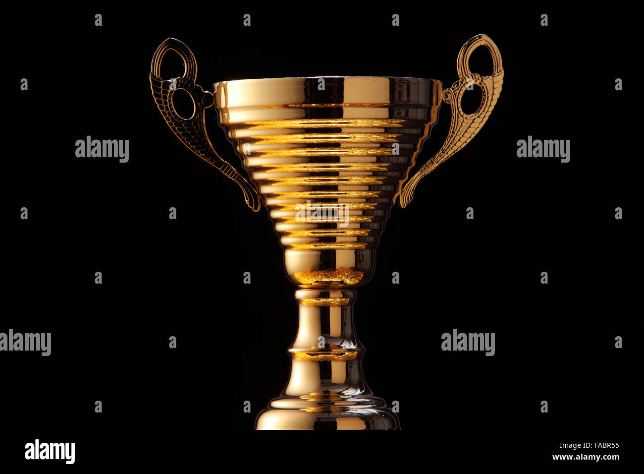 golden champion trophy on the black Stock Photo - Alamy